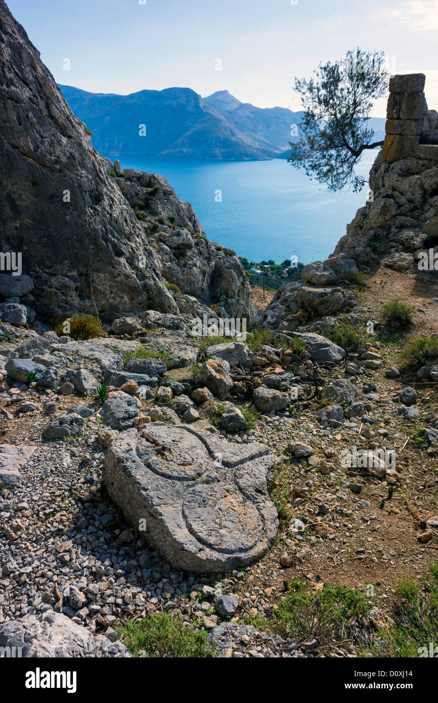 Ancient olive pressing stone and kastri castle hi-res stock photography ...