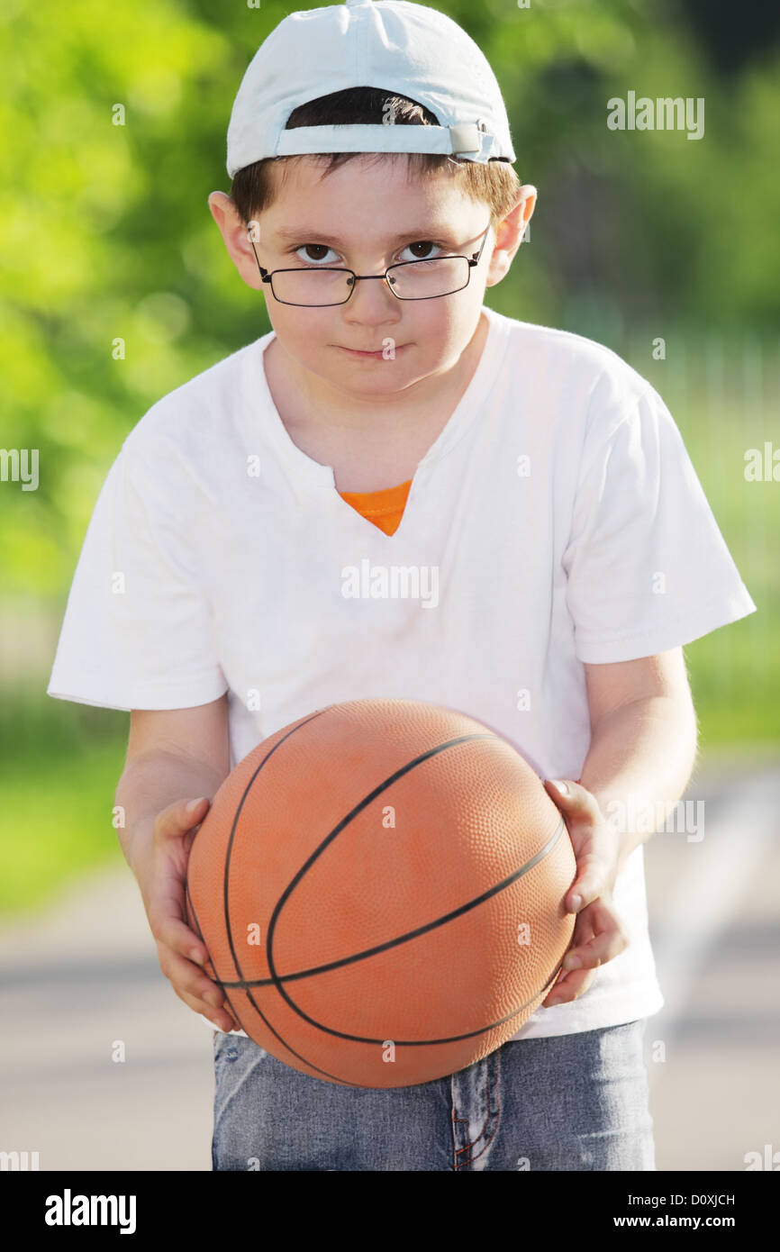 Boy with basketball Stock Photo - Alamy