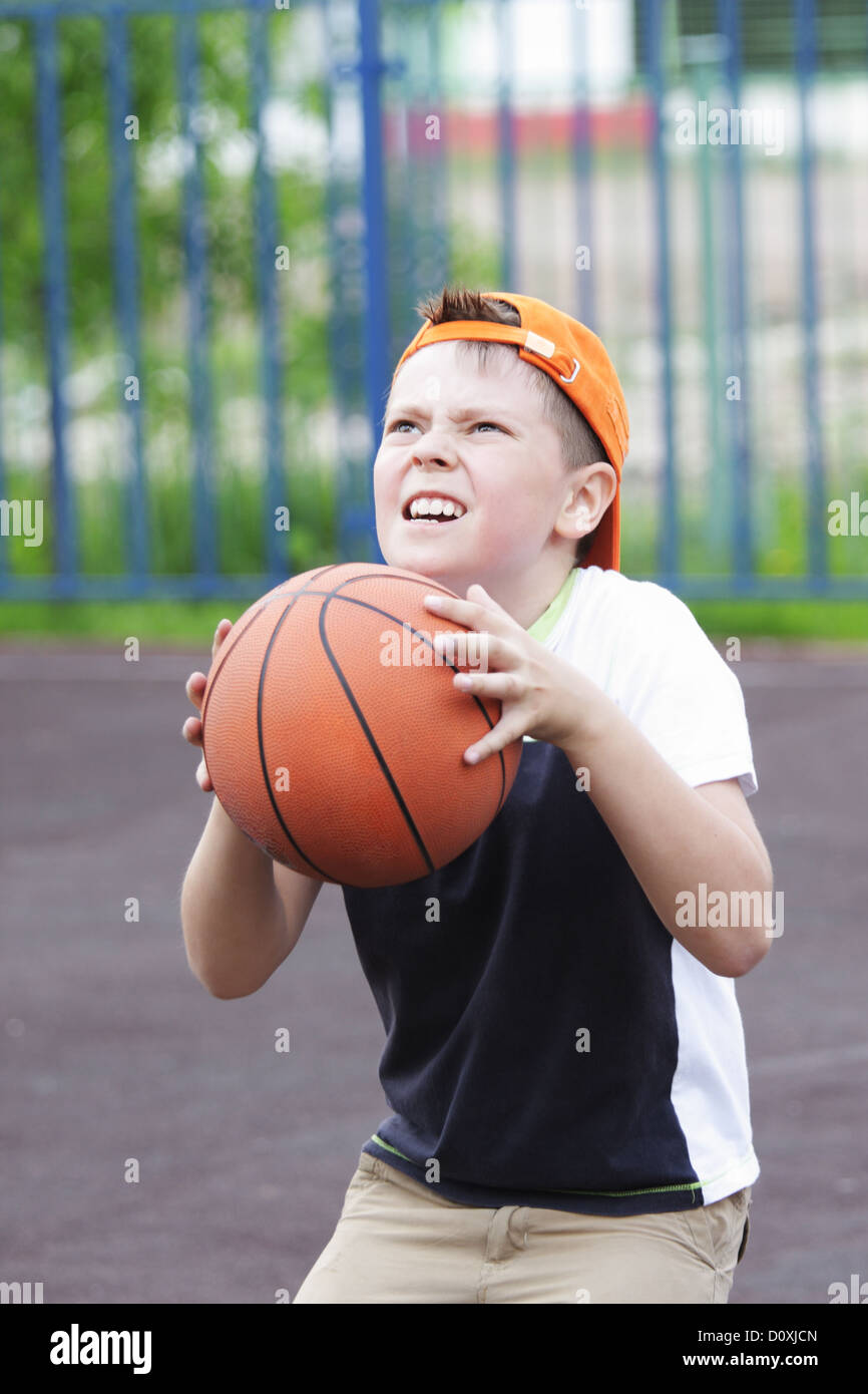 Boy going to throw ball Stock Photo - Alamy