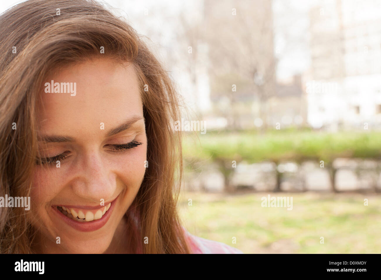 Woman with coy expression hi-res stock photography and images - Alamy