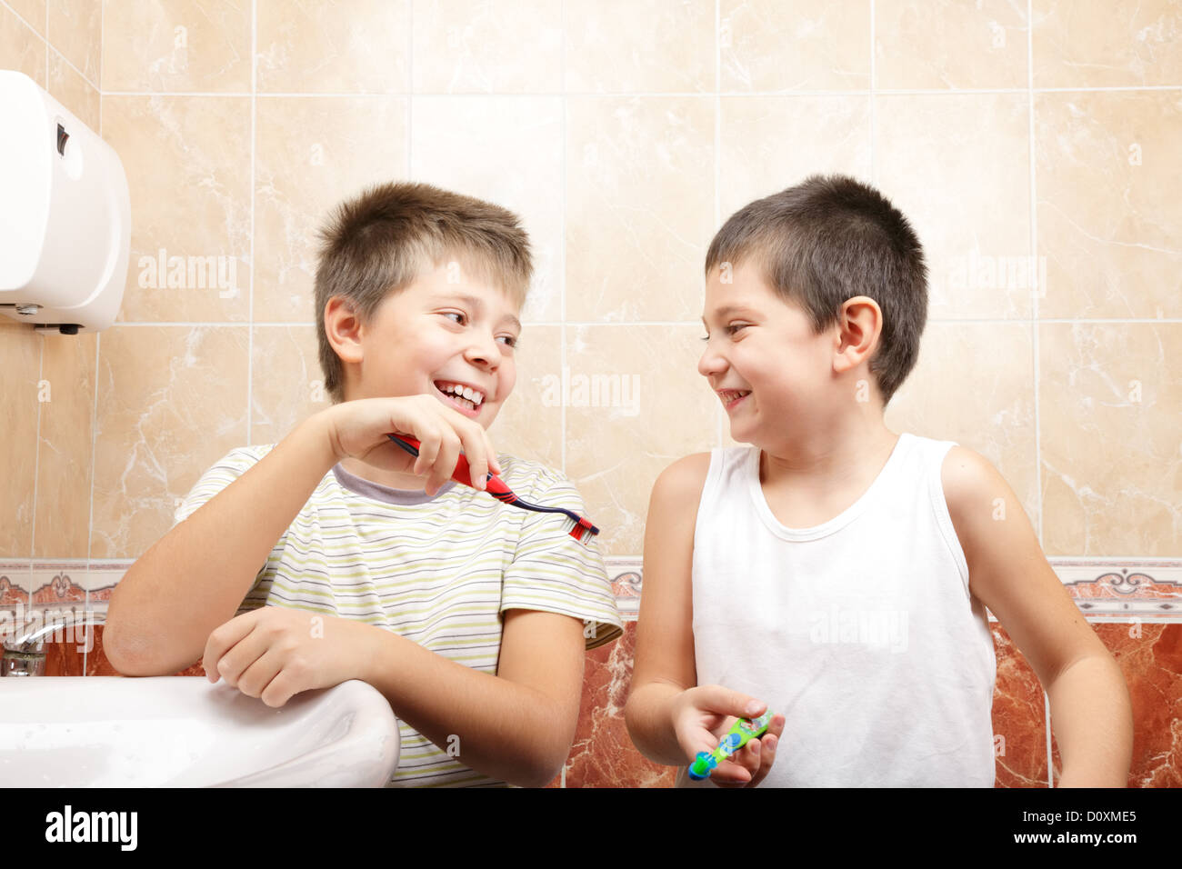 Funny boys with toothbrushes Stock Photo - Alamy