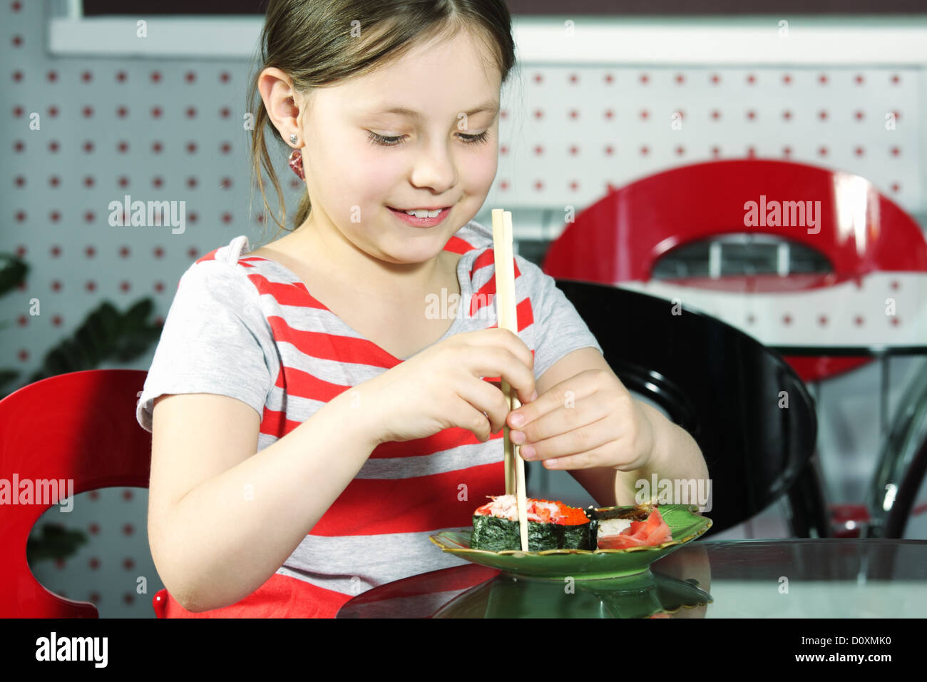 Girl with sticks Stock Photo - Alamy