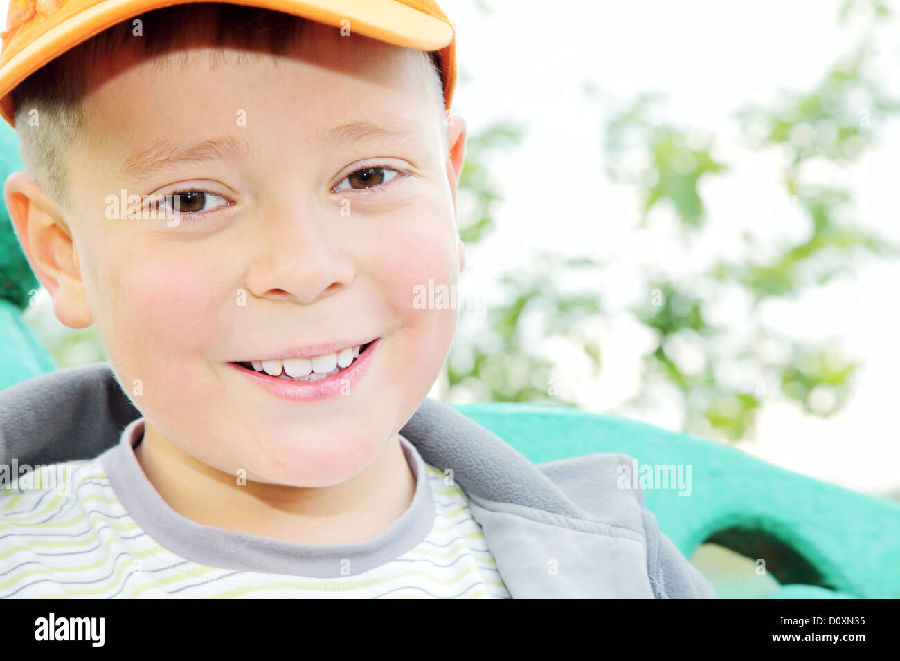 Toothy smiling boy outdoors Stock Photo - Alamy