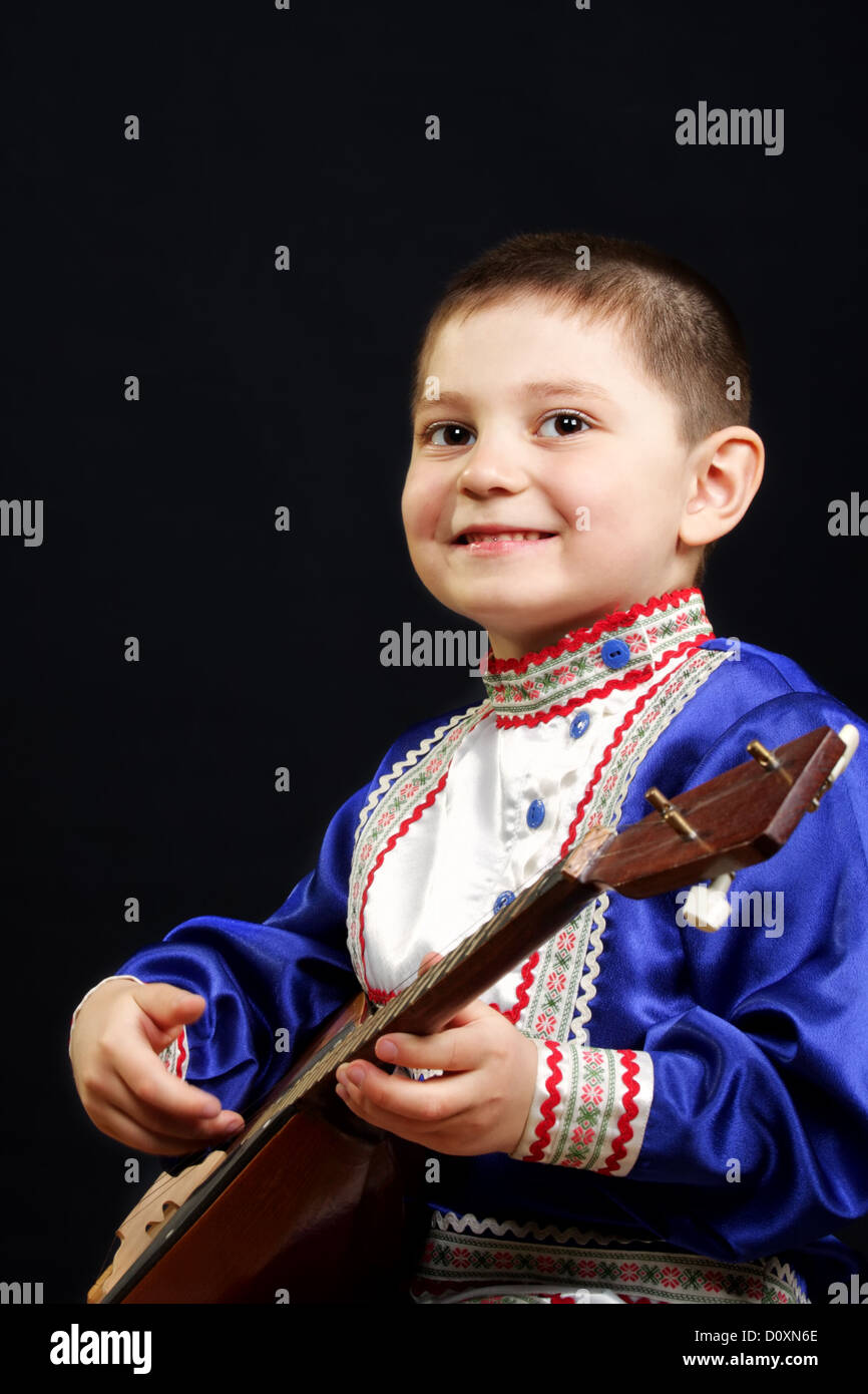 Smiling boy with balalaika Stock Photo - Alamy