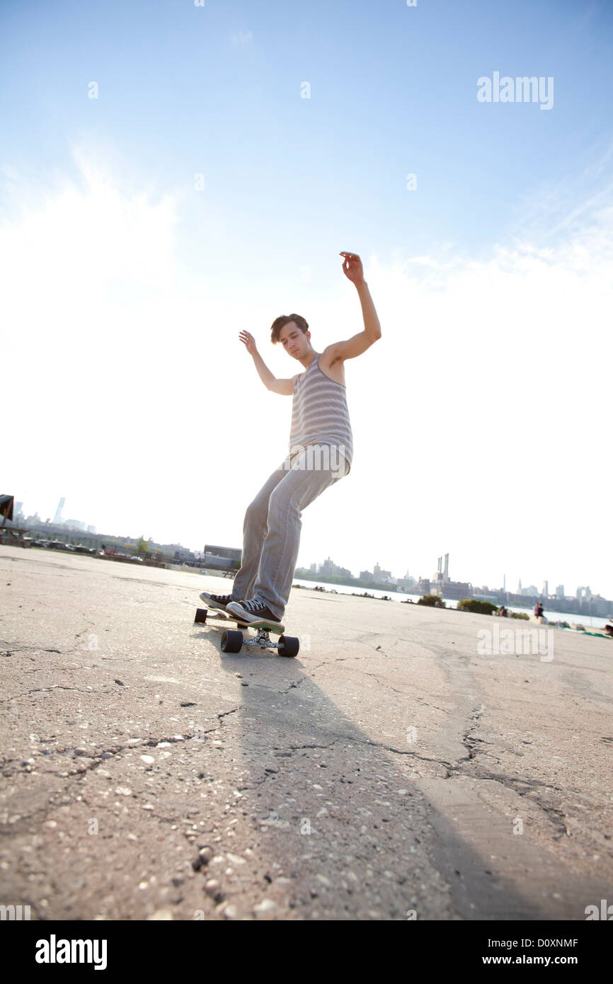 Young man skateboarding Stock Photo - Alamy