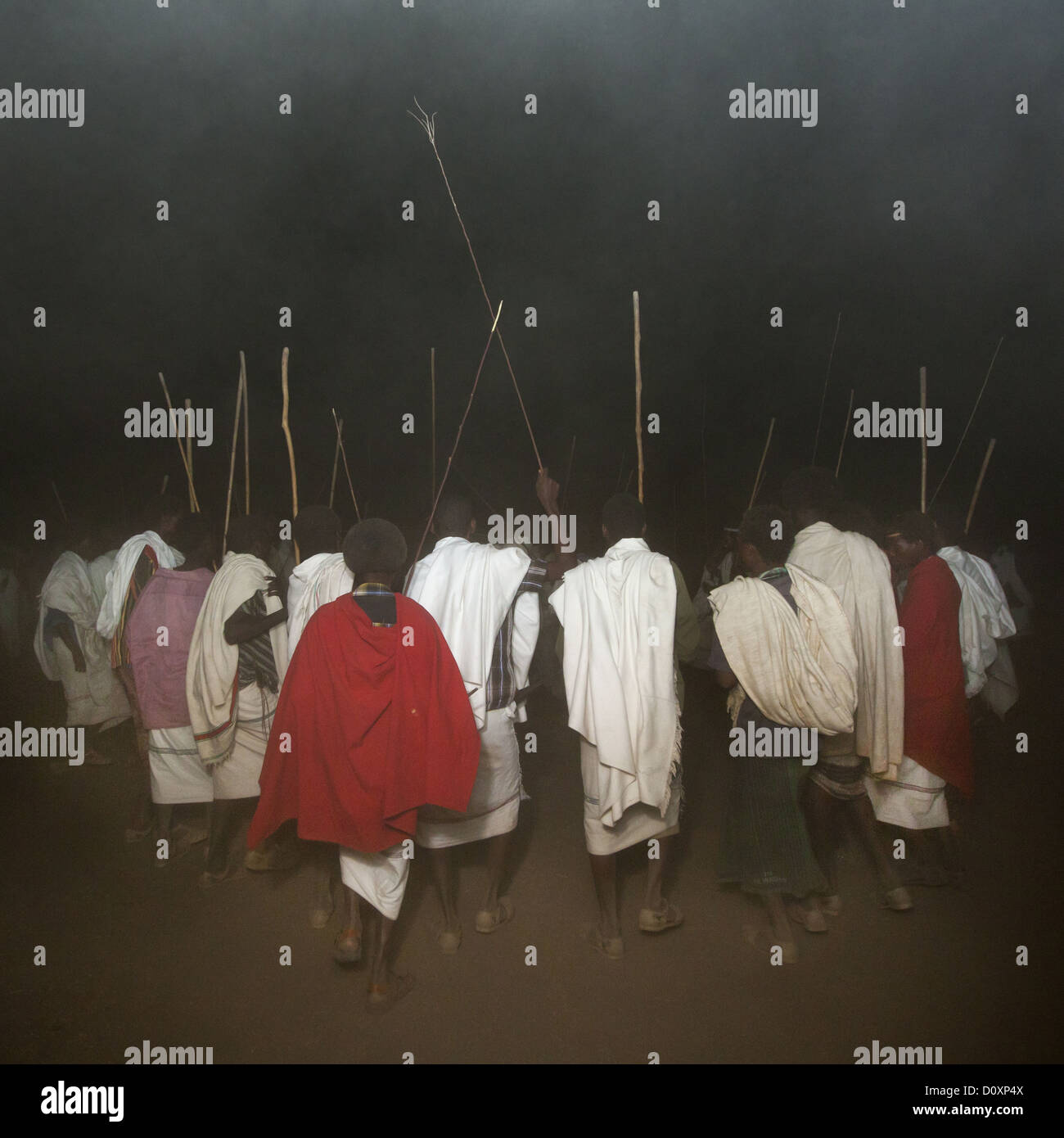 Rear View Of A Group Of Karrayyu Tribe Men In A Cloud Of Dust During ...