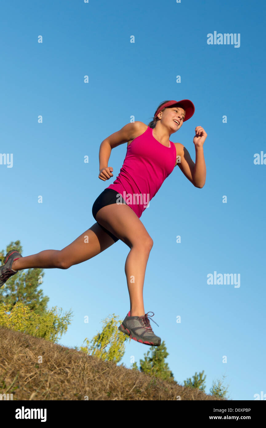 Teenage girl running Stock Photo - Alamy