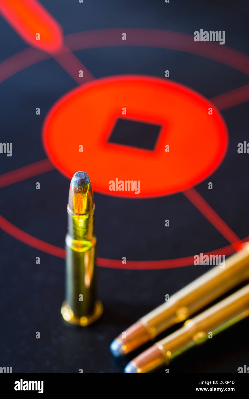 Rifle Ammunition caliber 30-30 on target disk Stock Photo - Alamy