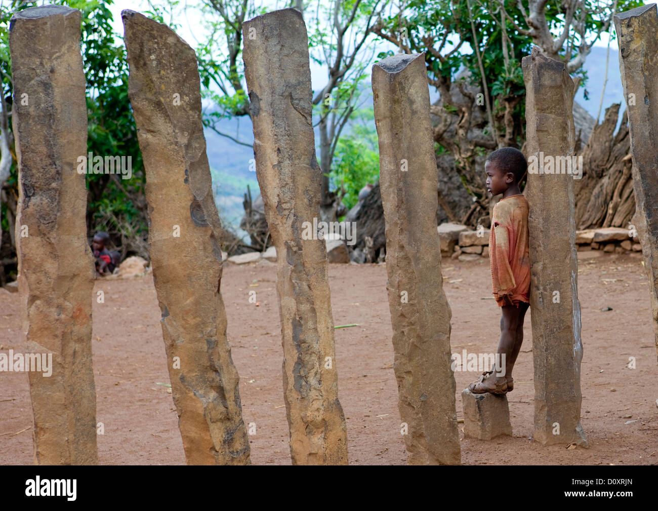 Kid Leaning On A Konso Stone Pillar In The Ceremony Square, Omo Valley ...