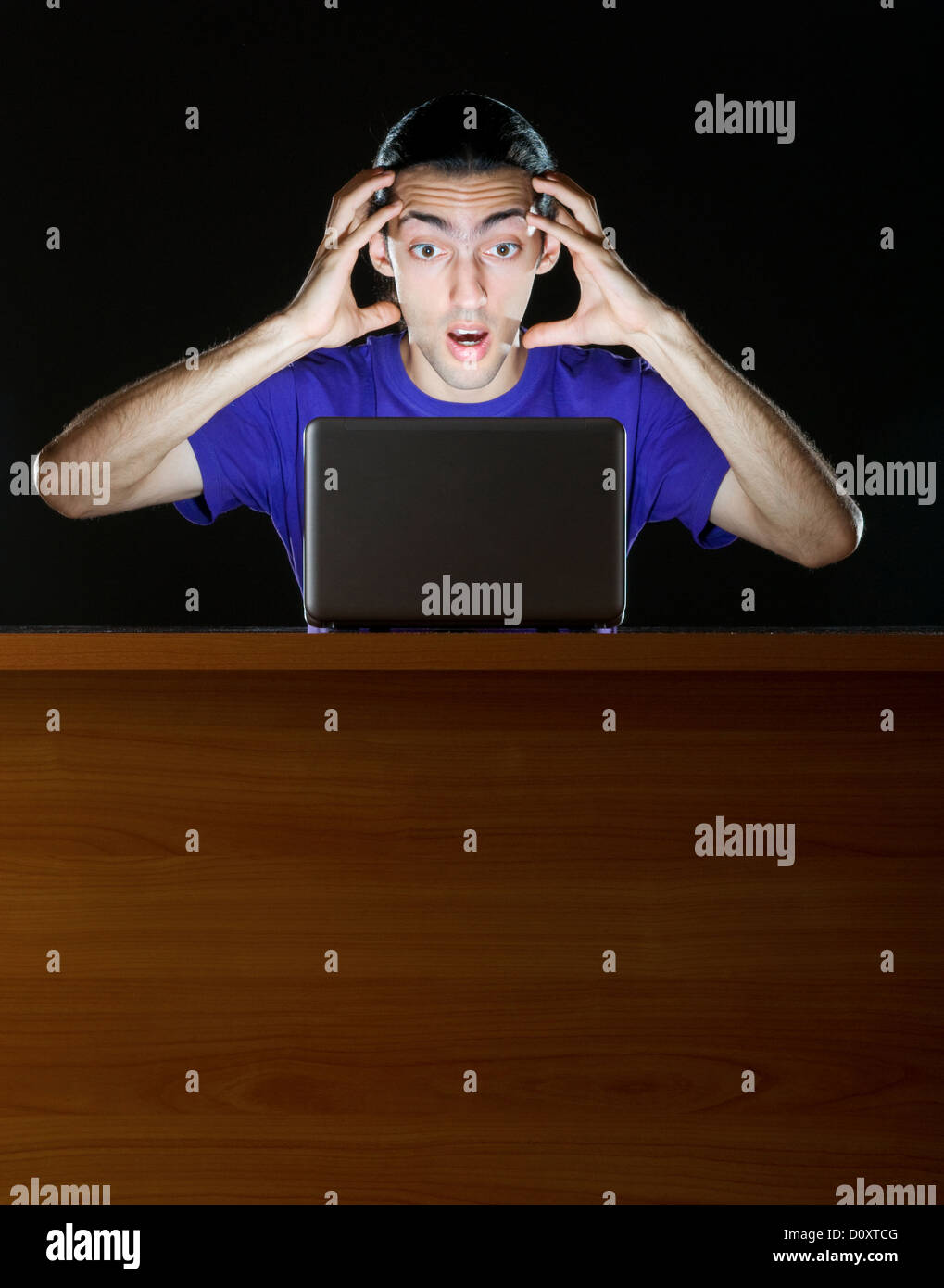 Hacker sitting in dark room Stock Photo - Alamy