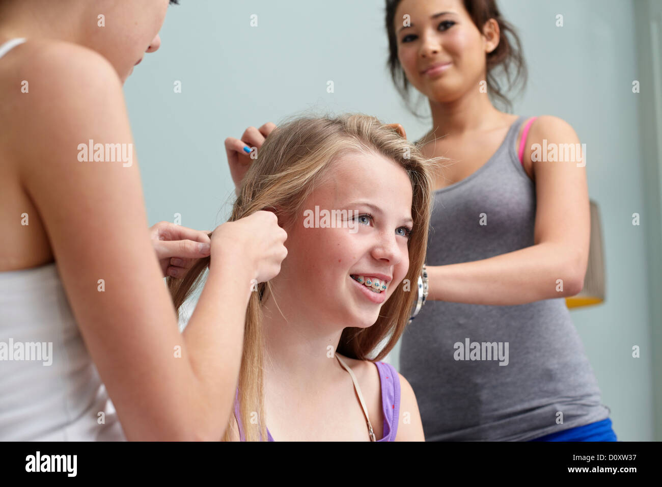 Girls braiding friends hair hi-res stock photography and images - Alamy