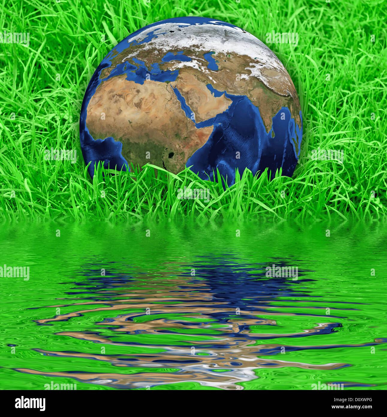 Earth at the green grass Stock Photo - Alamy