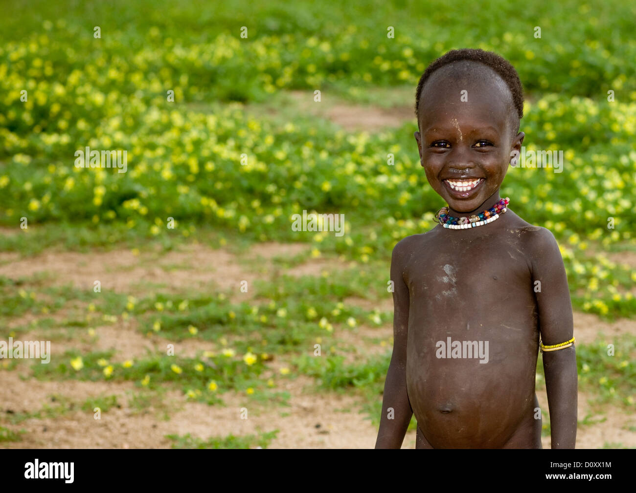 Portrait Of A Kid From Karo Tribe With Toothy Smile, Korcho Village ...
