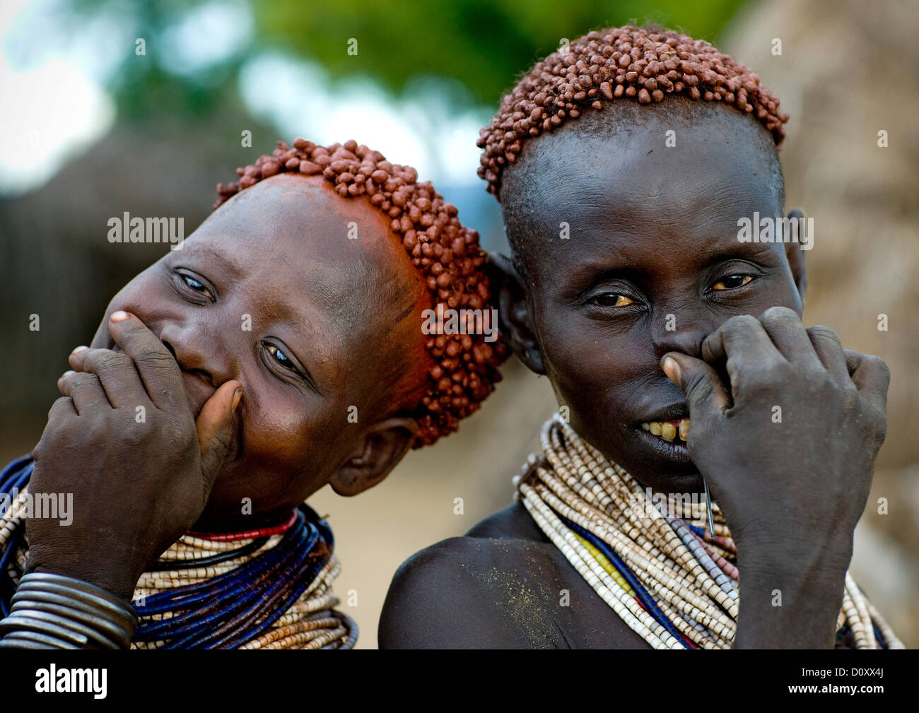 Portrait Of Laughing Karo Tribe Girls With Coffee Bean Hairstyle ...