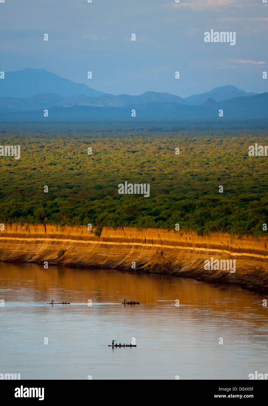 Boats Crossing Omo River With Mountains In The Background, Omo Valley ...