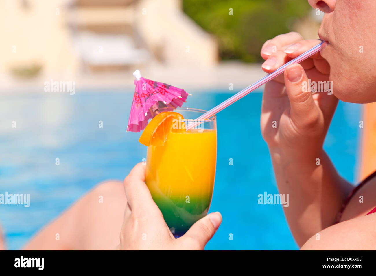 Woman hand drinking cocktail Stock Photo - Alamy