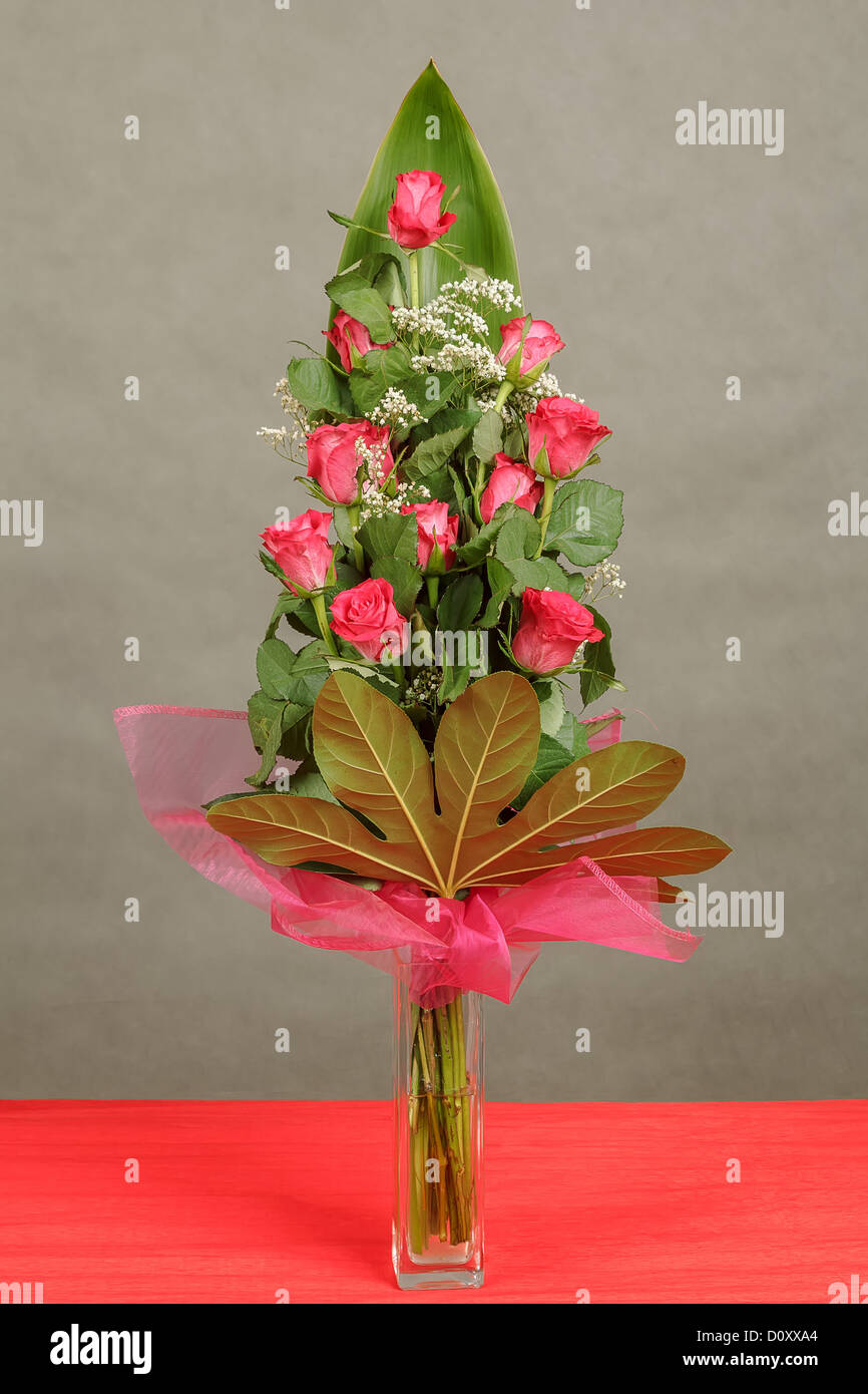 bouquet of eleven red roses in vase Stock Photo - Alamy