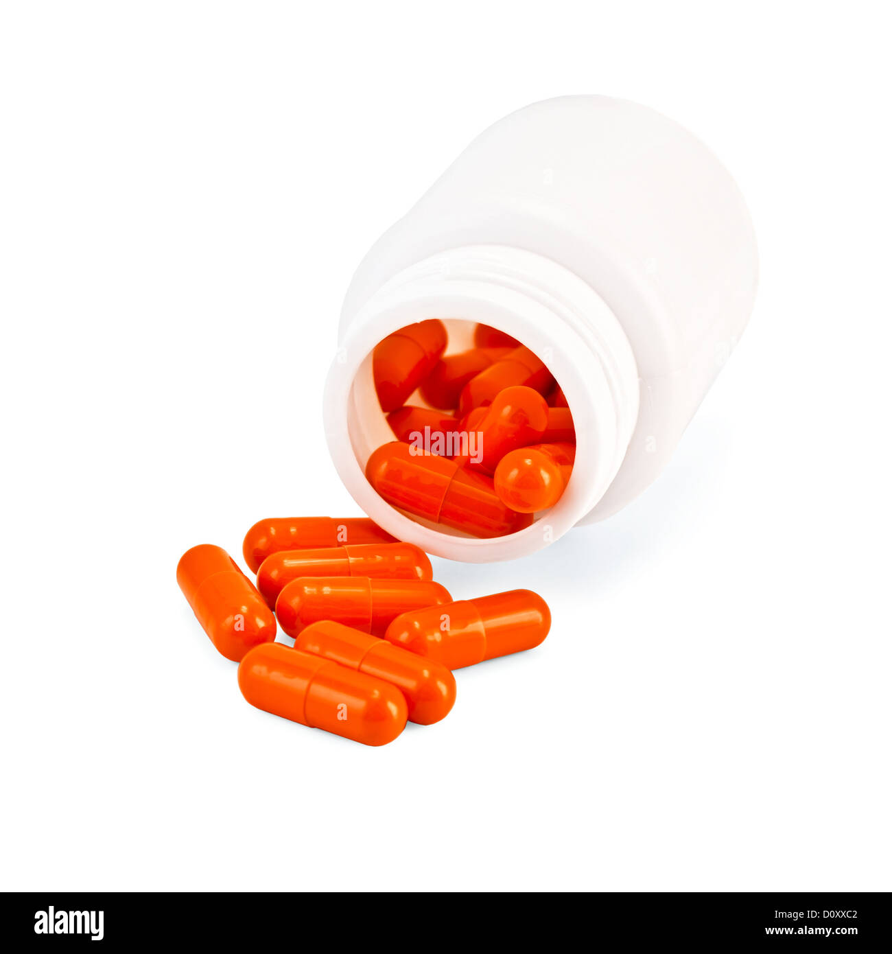 Orange capsules in a white jar isolated on white background Stock Photo ...