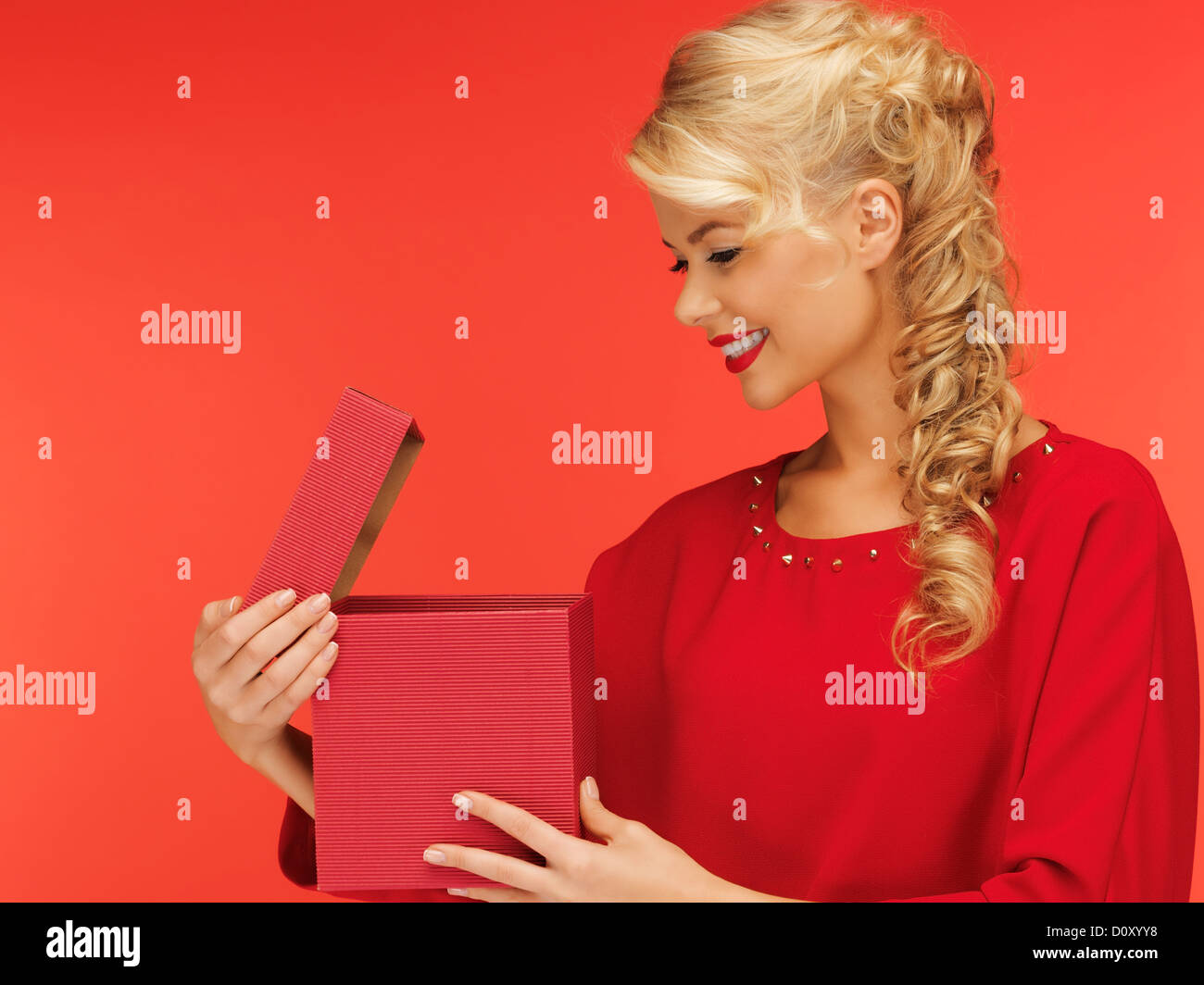 lovely woman in red dress with opened gift box Stock Photo - Alamy