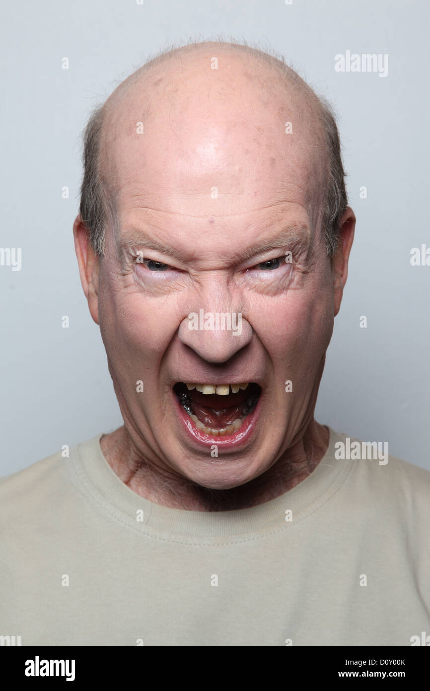 Angry man showing his teeth Stock Photo - Alamy