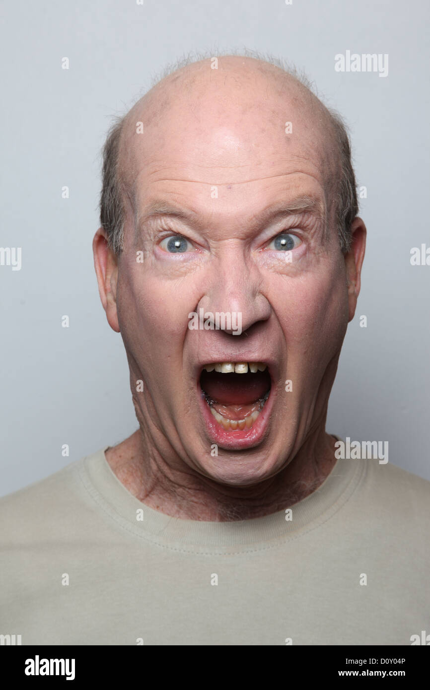 Angry man showing his teeth Stock Photo - Alamy