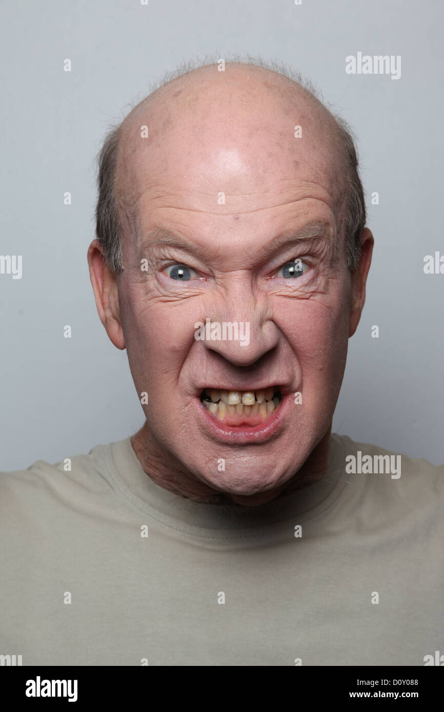 Angry man showing his teeth Stock Photo - Alamy