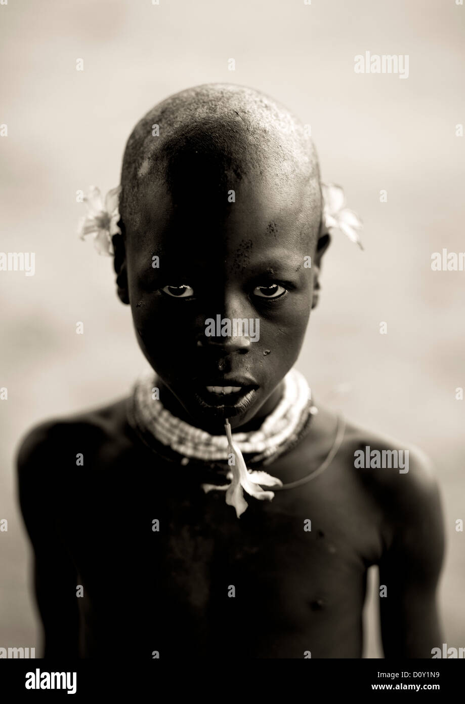 Portrait Of A Karo Tribe Kid With Flowers As Earrings, Korcho Village ...