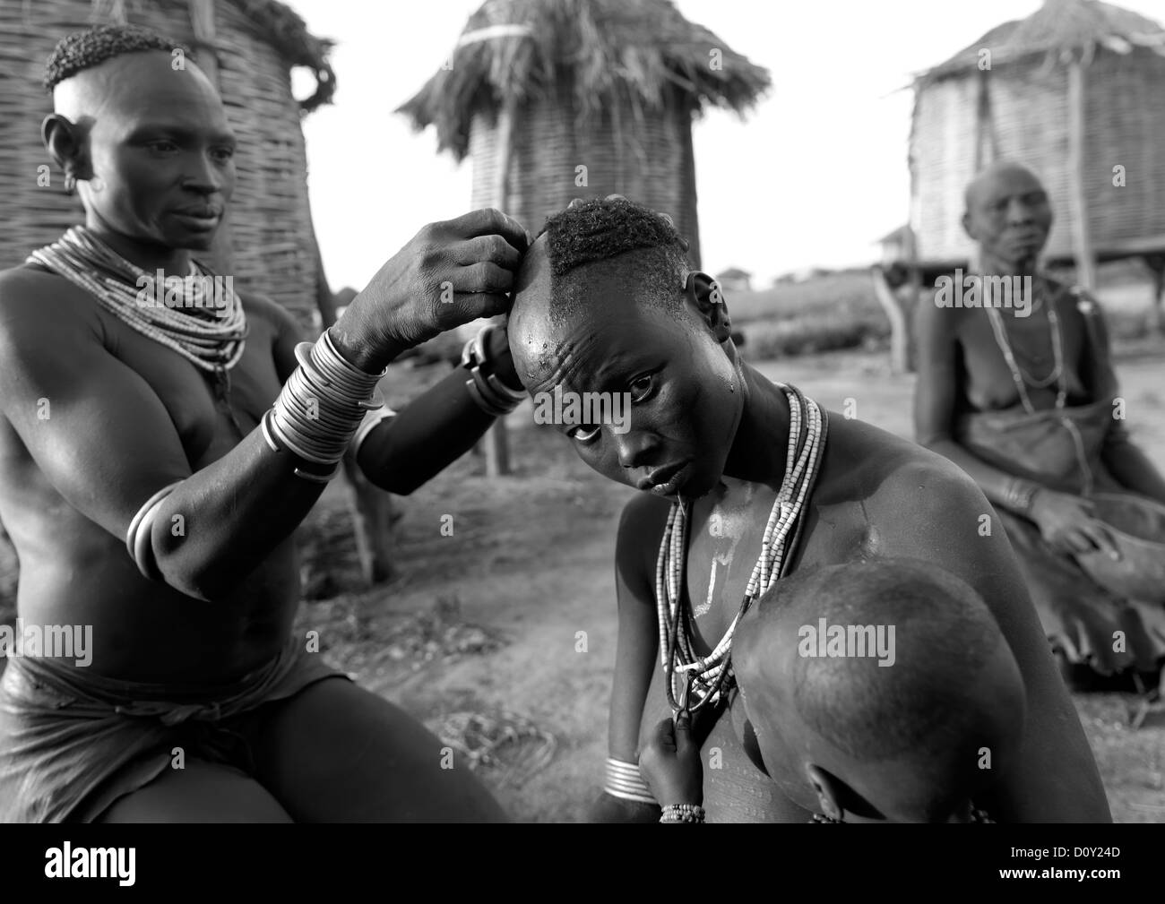 Black And White Picture Of A Karo Tribe Woman Receiving A Haircut ...