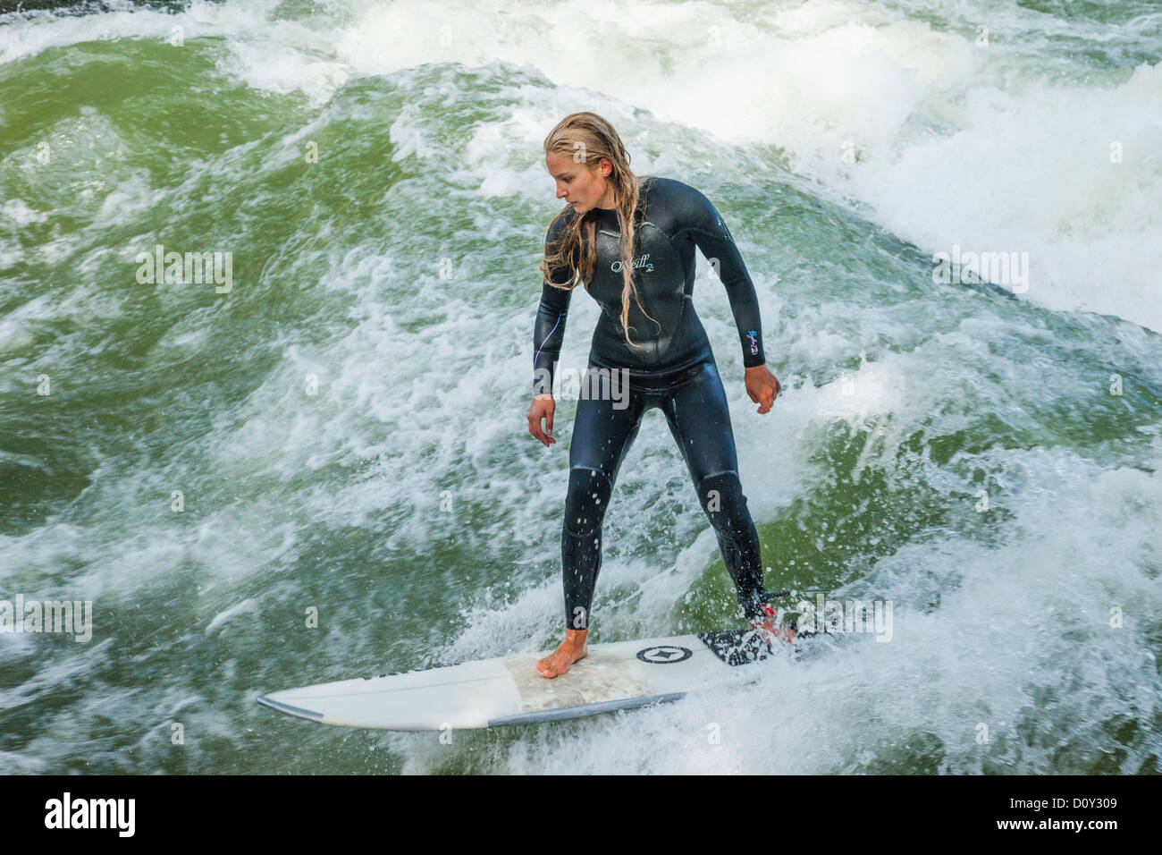 Germany, Bavaria, Munich, English Garden, Female Surfer on the Eisbach ...