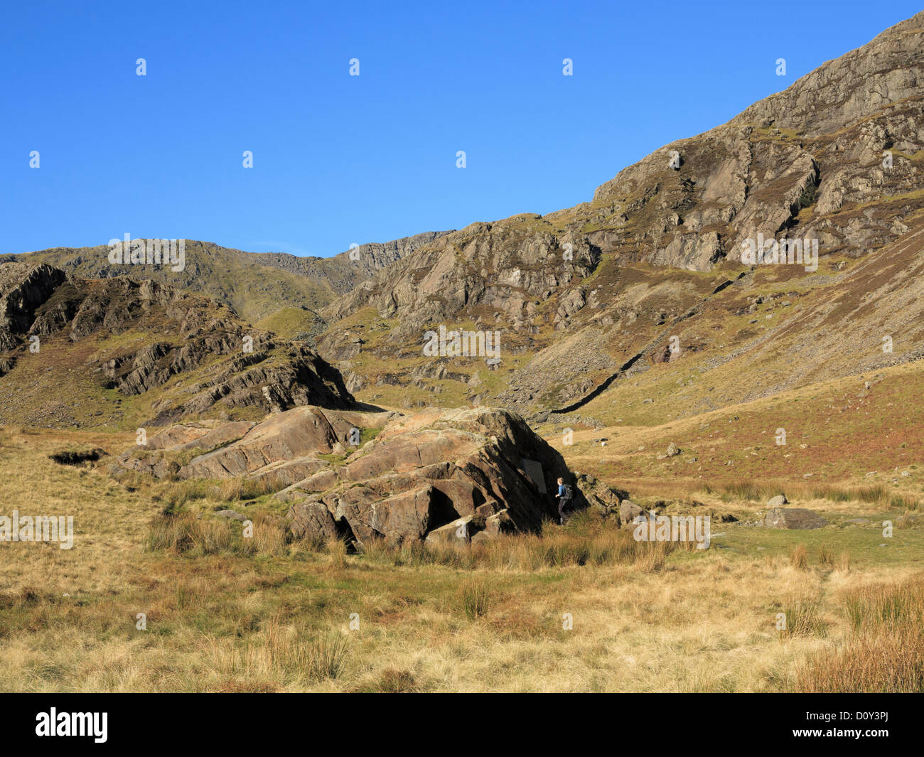 The Gladstone Rock with a walker reading the plaque in Cwm LLan ...