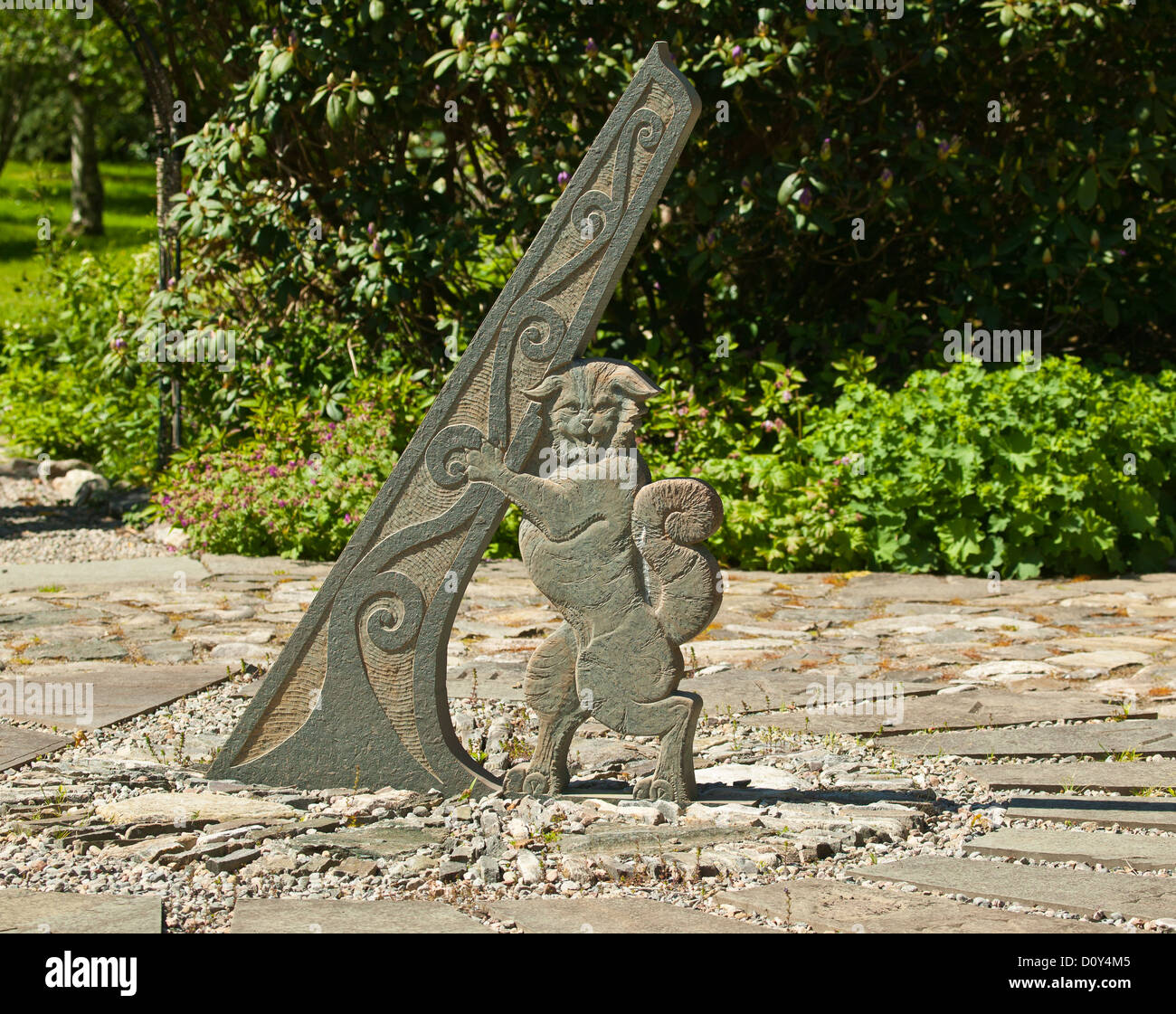 A SCOTTISH SUNDIAL WITHIN A LARGE GARDEN THE GNOMON IS HELD BY A ...