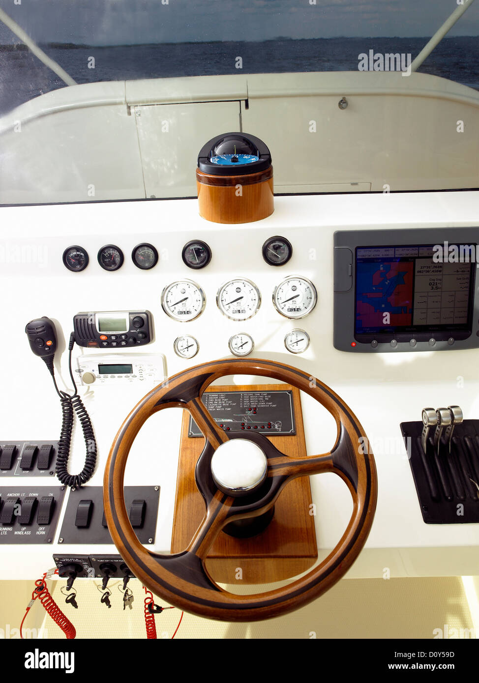 instruments and wheel of boat Stock Photo - Alamy
