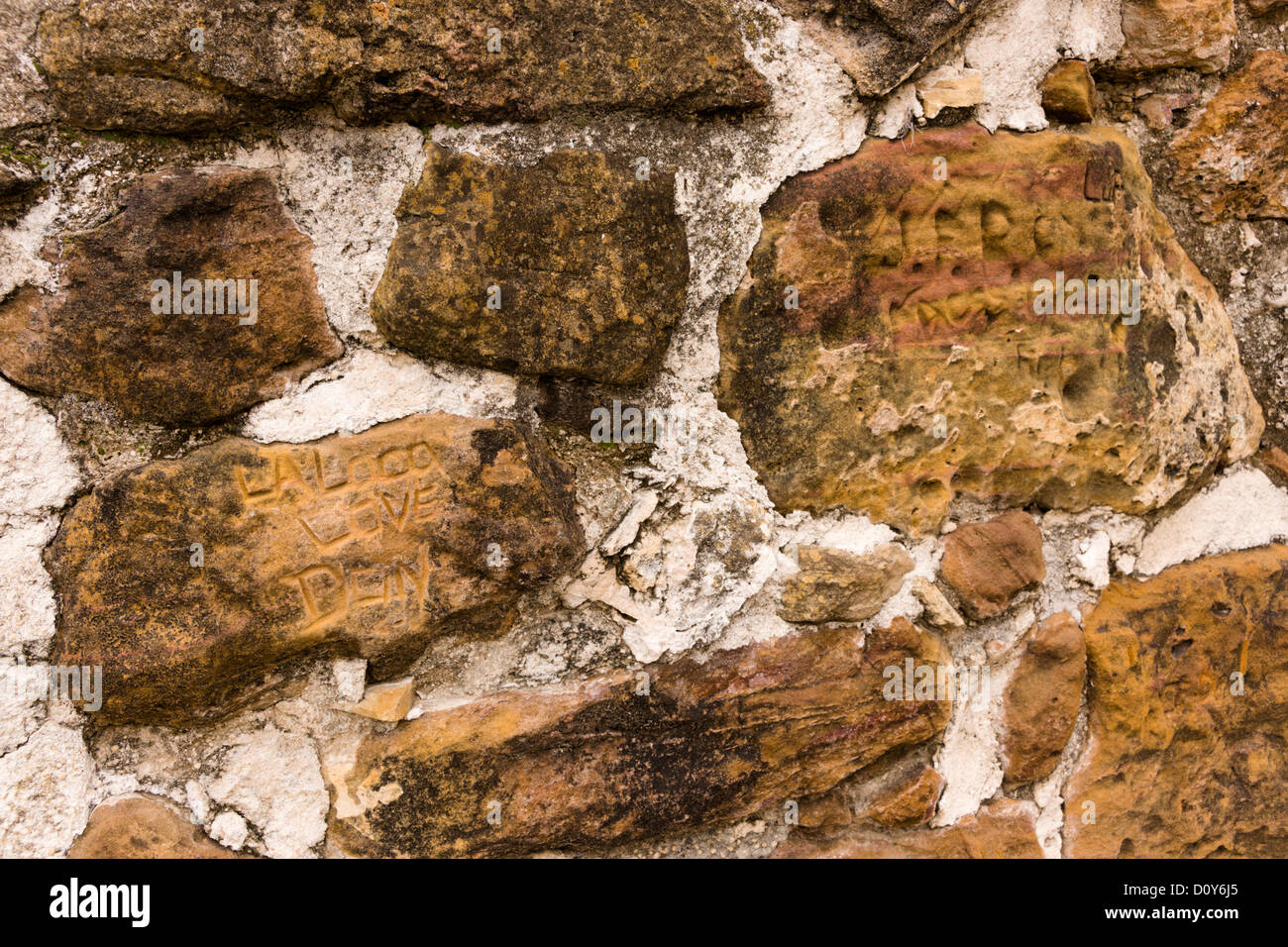 Graffiti carved into sandstone blocks inside the main gate at Mission ...