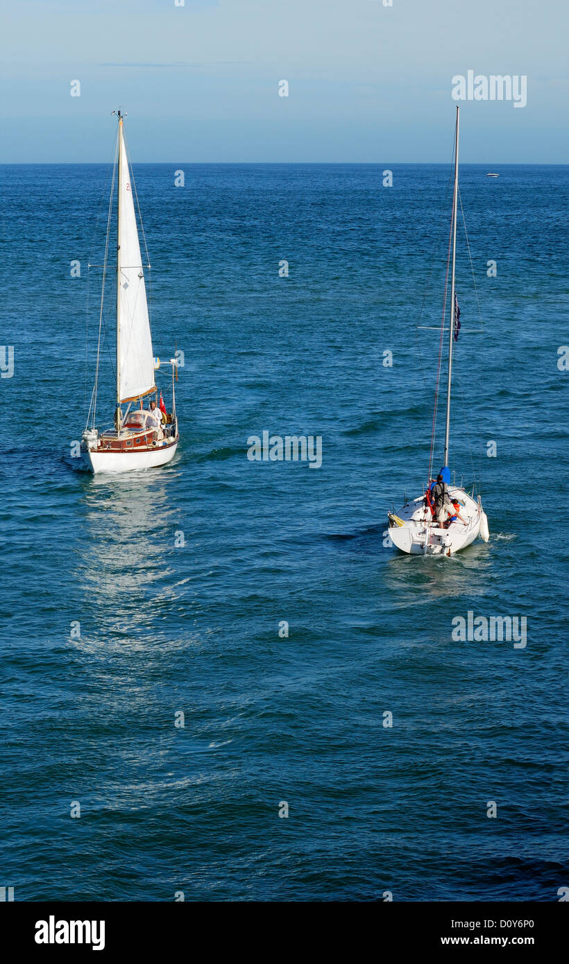 Two yachts sailing past each other by Brighton Marina. East Sussex ...