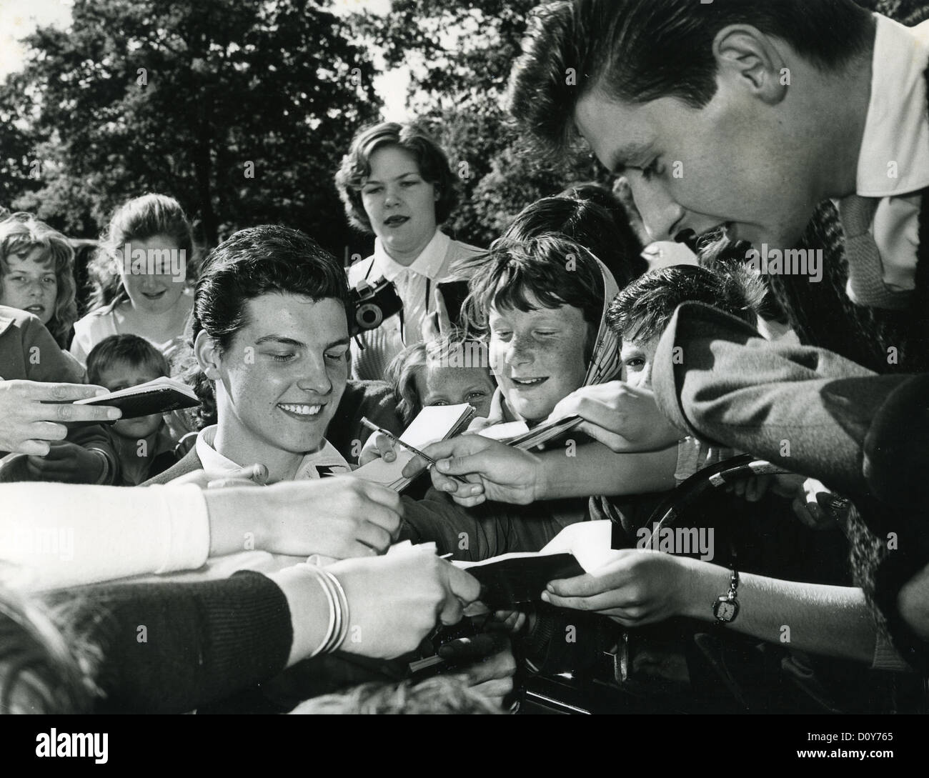JESS CONRAD UK pop singer and film actor with fans about 1961 Stock ...