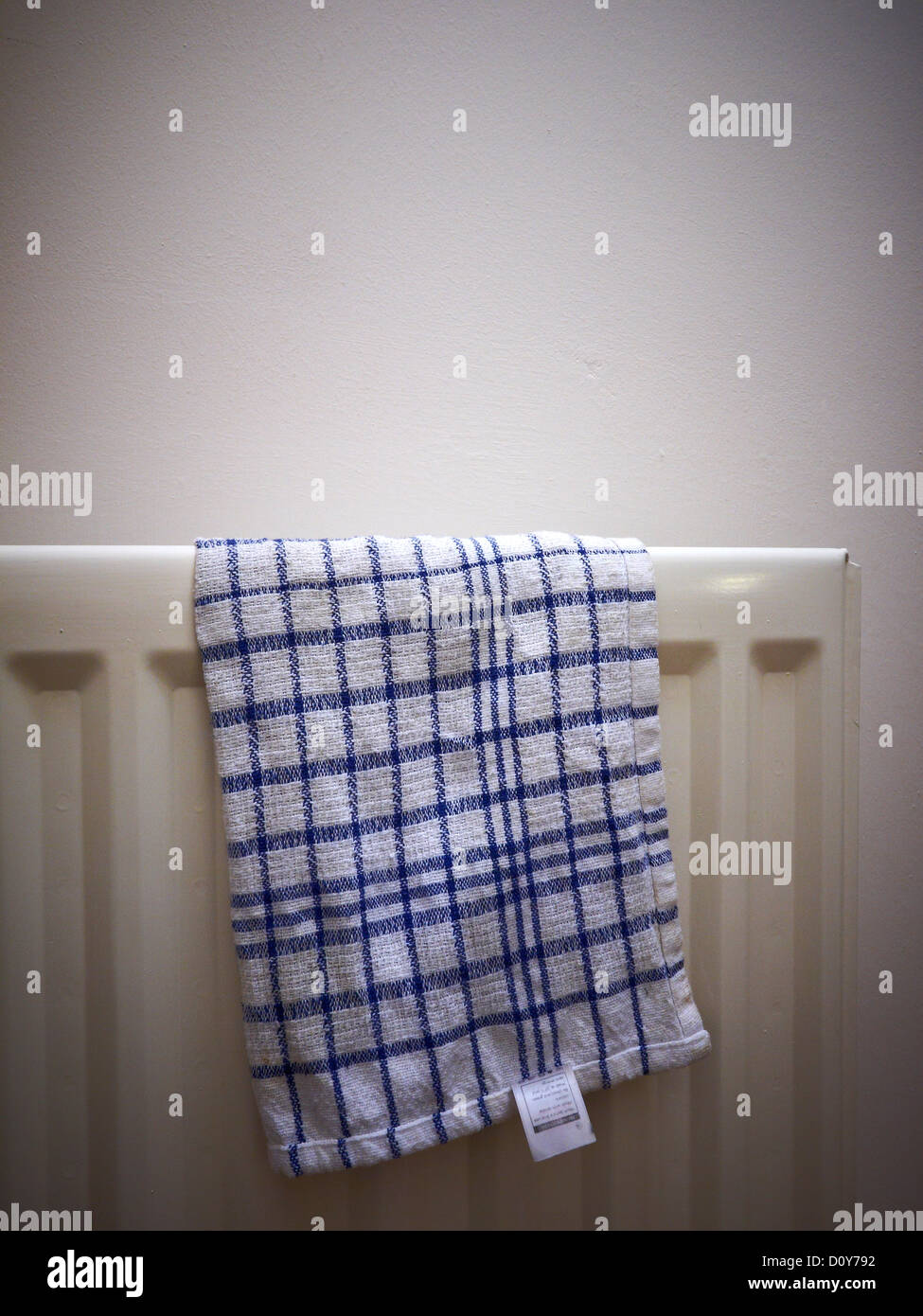 Tea towel drying on radiator Stock Photo - Alamy