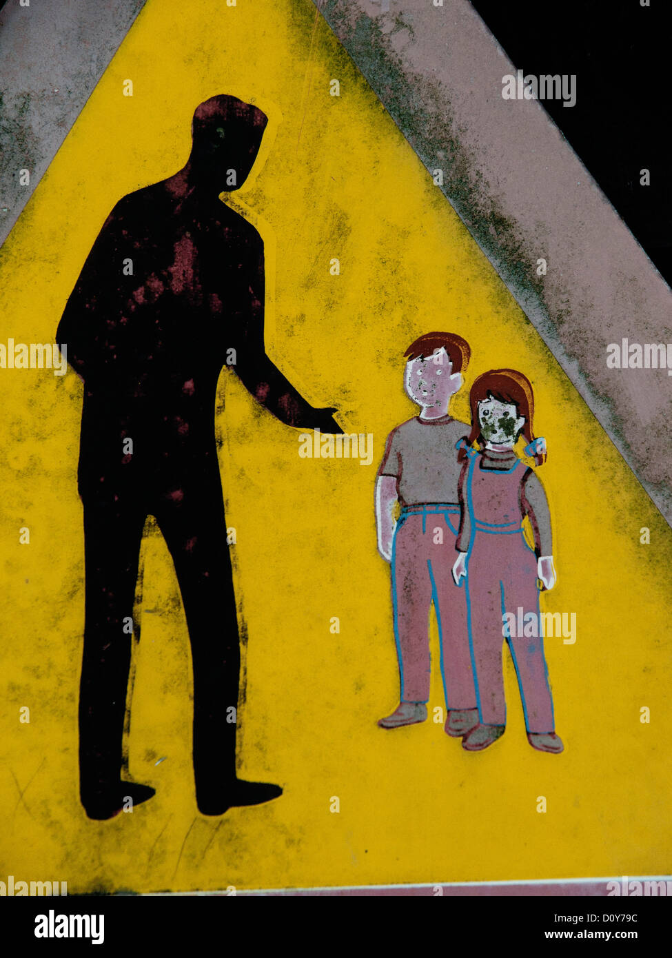 An old sign in a village,warning children to beware of strangers Stock ...