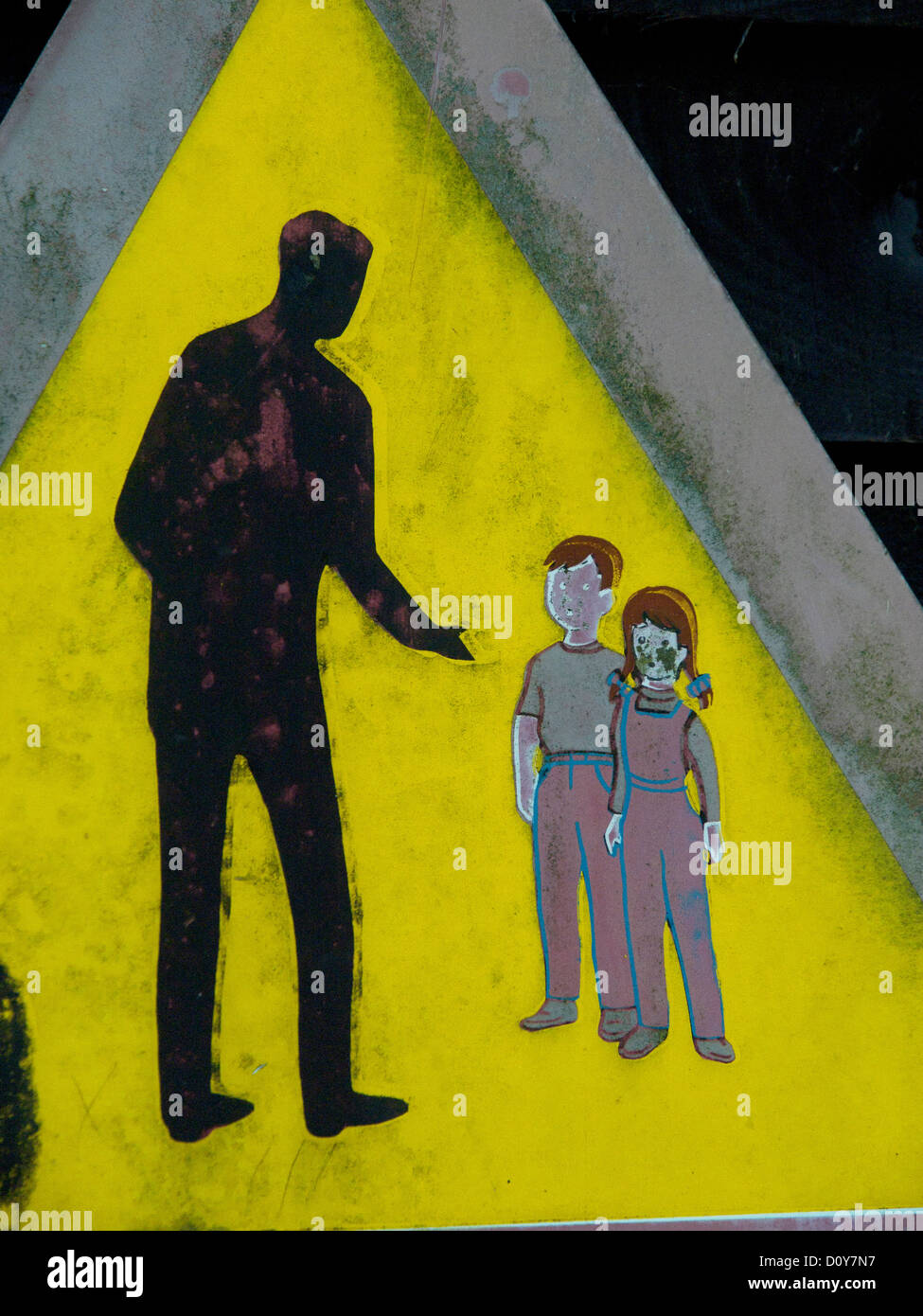 An old sign in a village,warning children to beware of strangers Stock ...