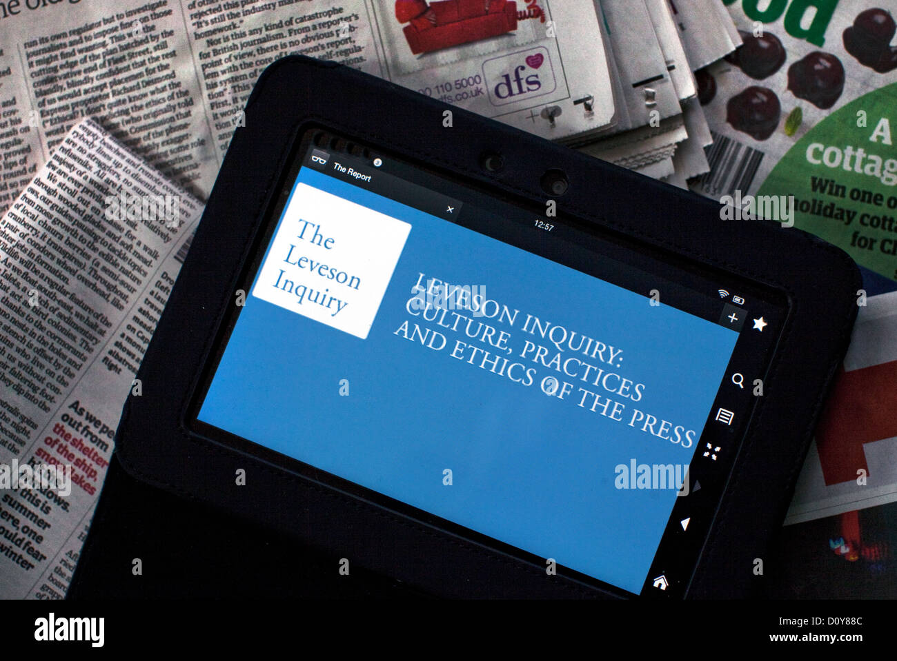 The Leveson Report on press ethics on a tablet device, London Stock ...