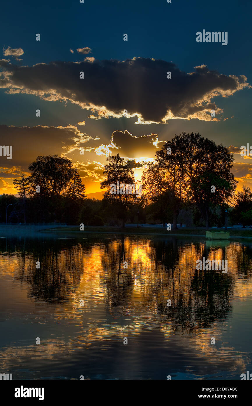 Clouds and Inspirational Sunset with Trees and Lake Stock Photo - Alamy