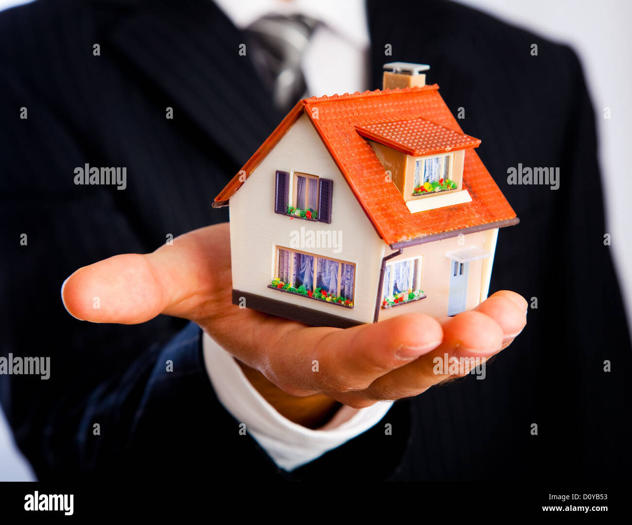 house in a hand Stock Photo - Alamy