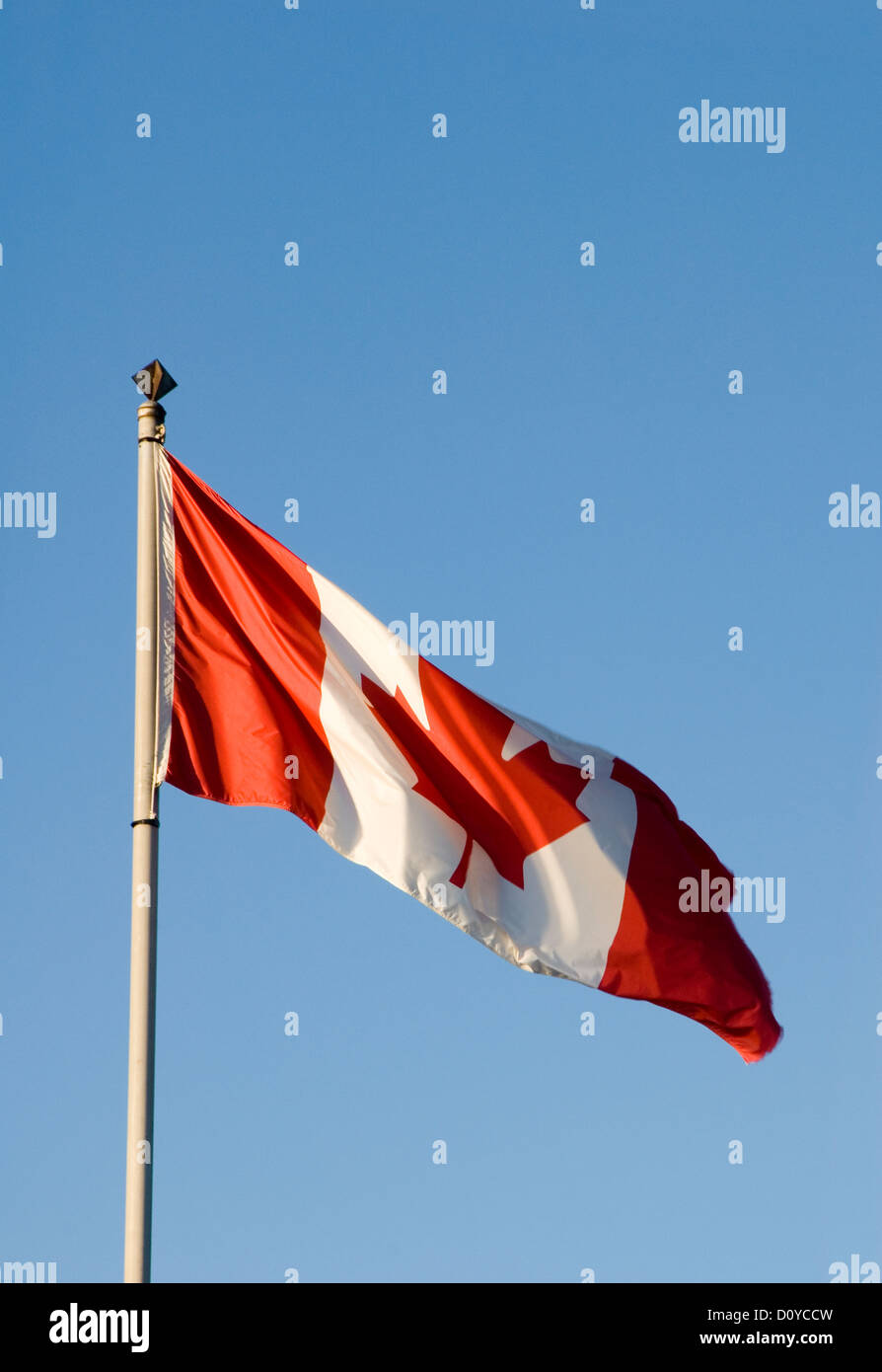 Canadian flag against blue hi-res stock photography and images - Alamy