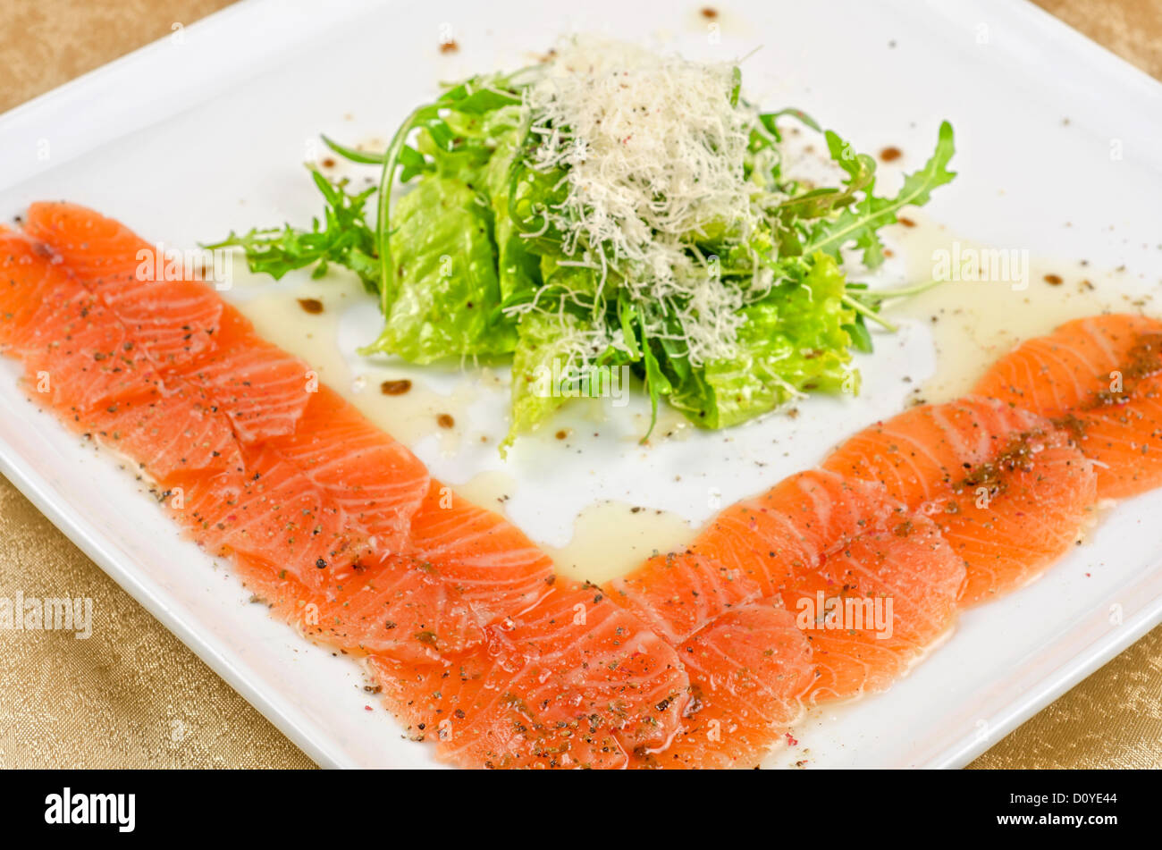 Fish Carpaccio with salad Stock Photo - Alamy