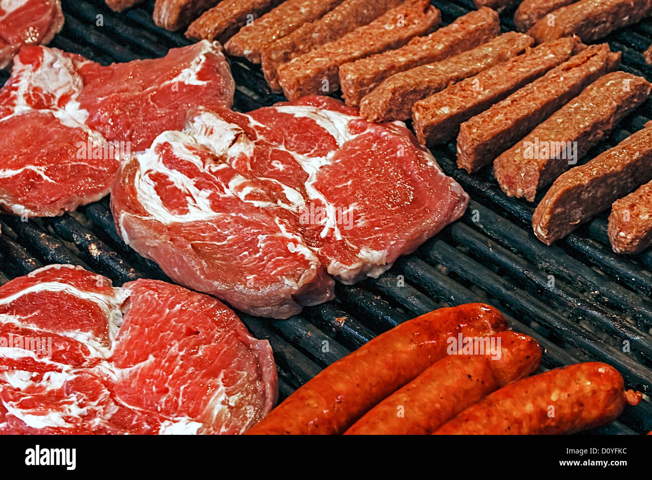 Romanian sausages (mici) and red meat on a grill Stock Photo - Alamy
