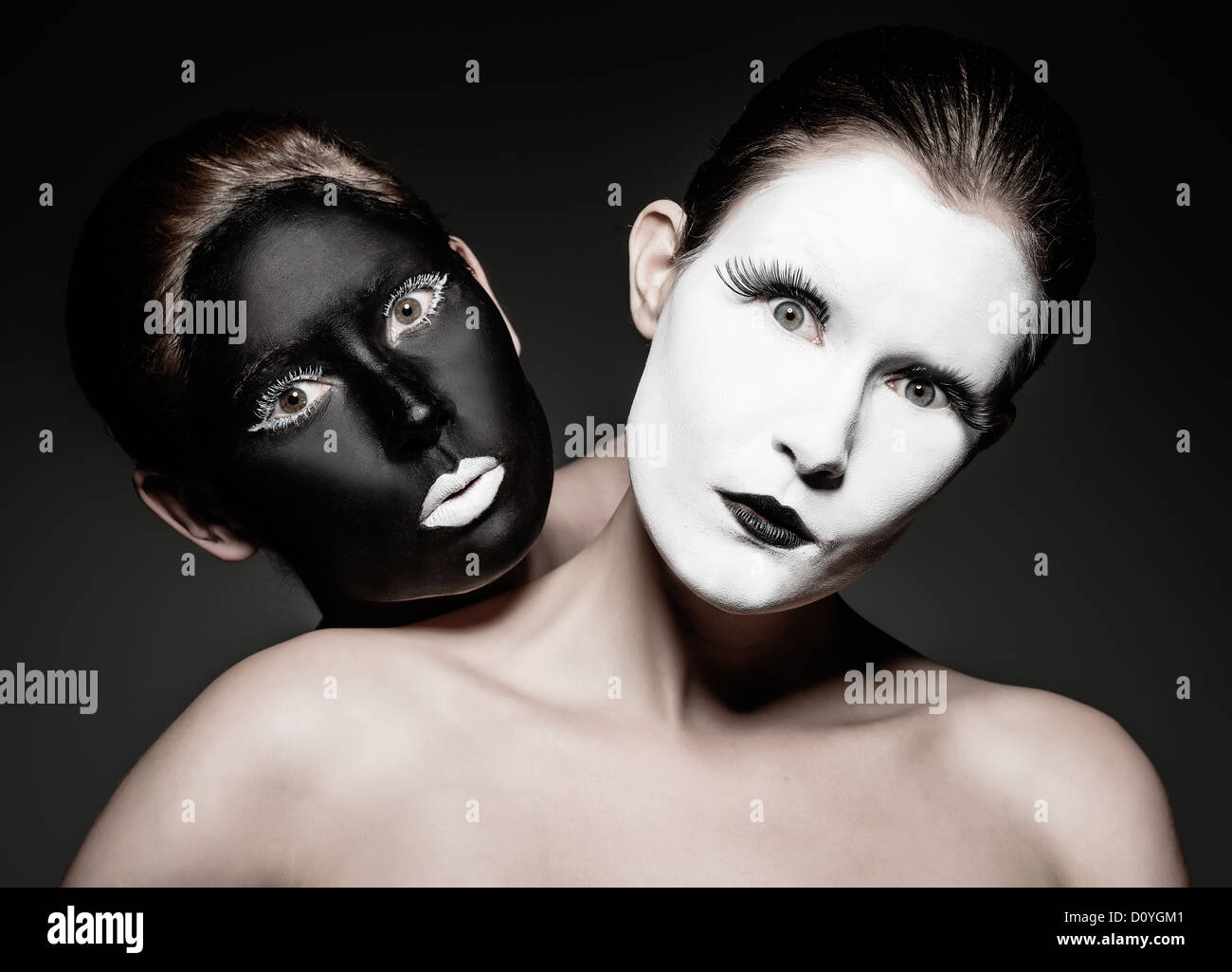 two young girls with ying yang style makeup Stock Photo - Alamy