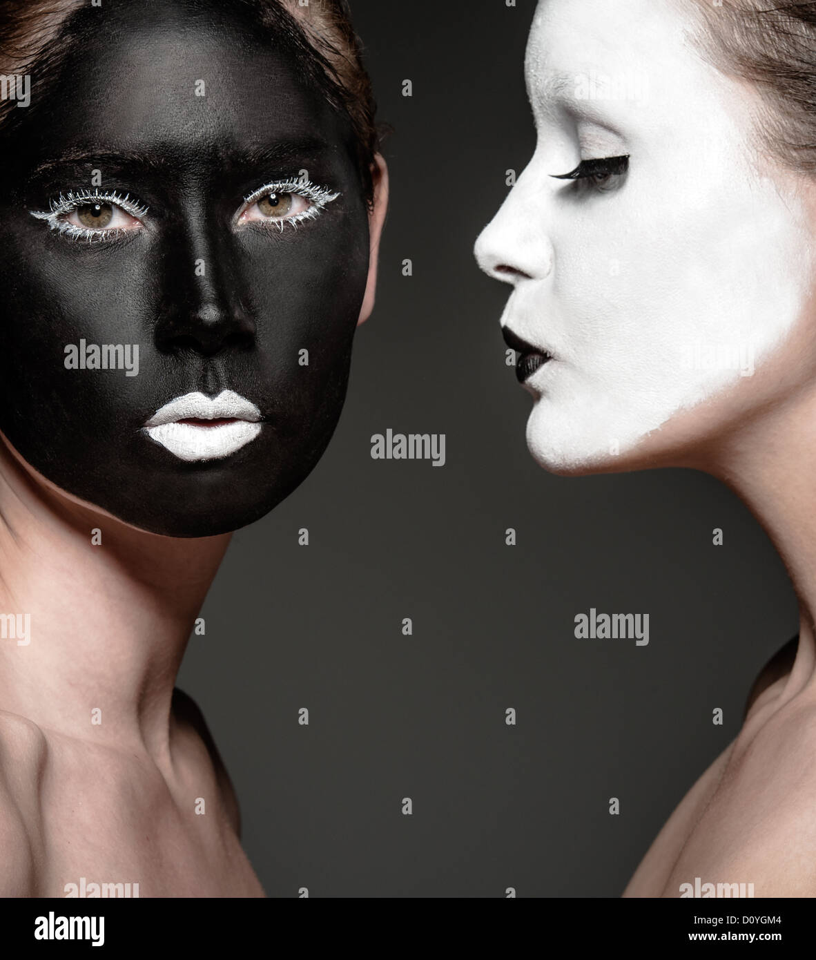 two young girls with ying yang style makeup Stock Photo - Alamy