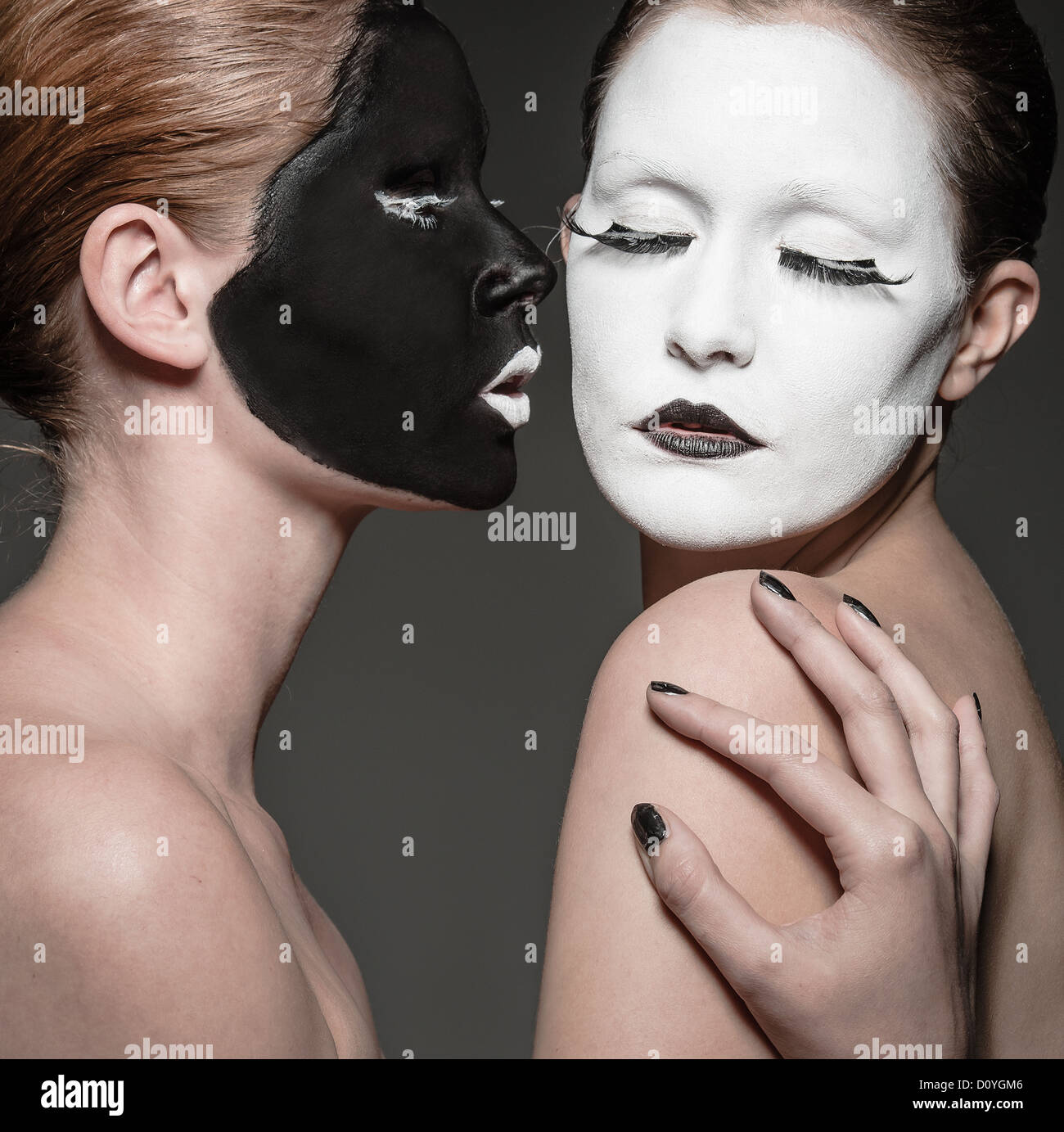 two young girls with ying yang style makeup Stock Photo - Alamy