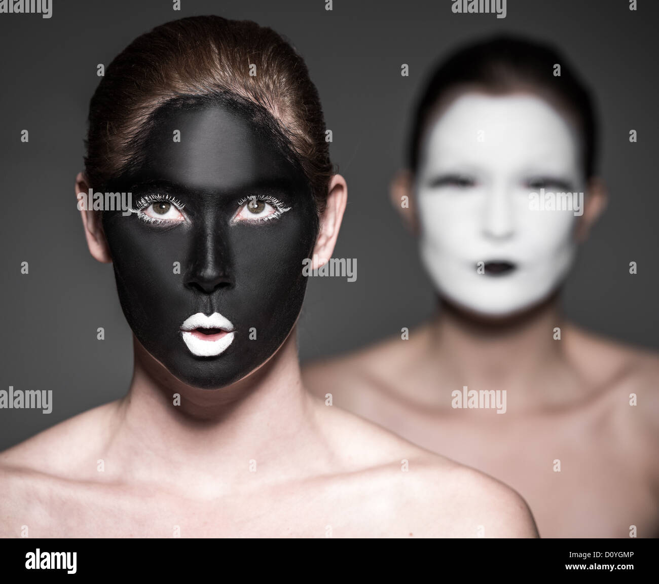 two young girls with ying yang style makeup Stock Photo - Alamy