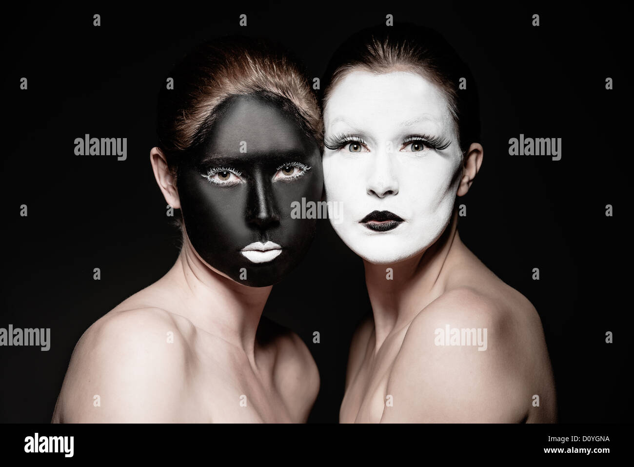 two young girls with ying yang style makeup Stock Photo - Alamy