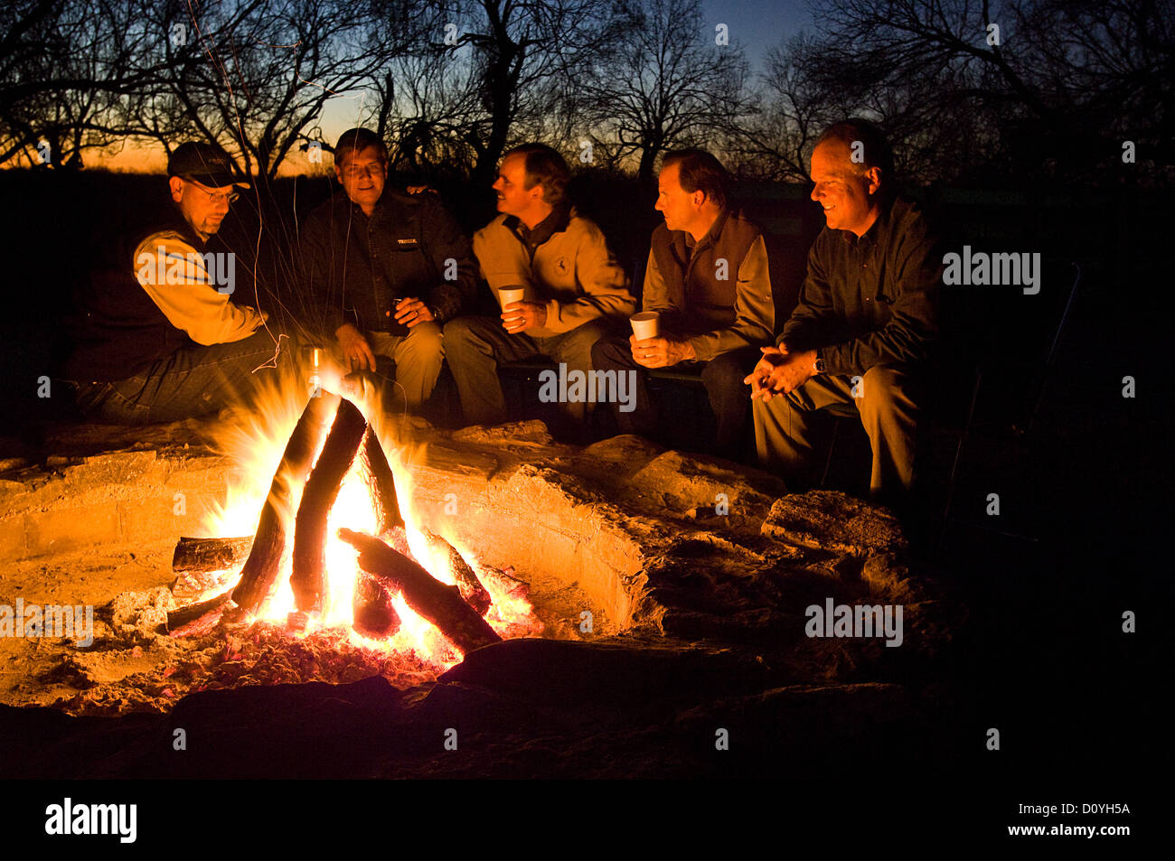 Deer hunters sitting around a campfire in South Texas Stock Photo - Alamy